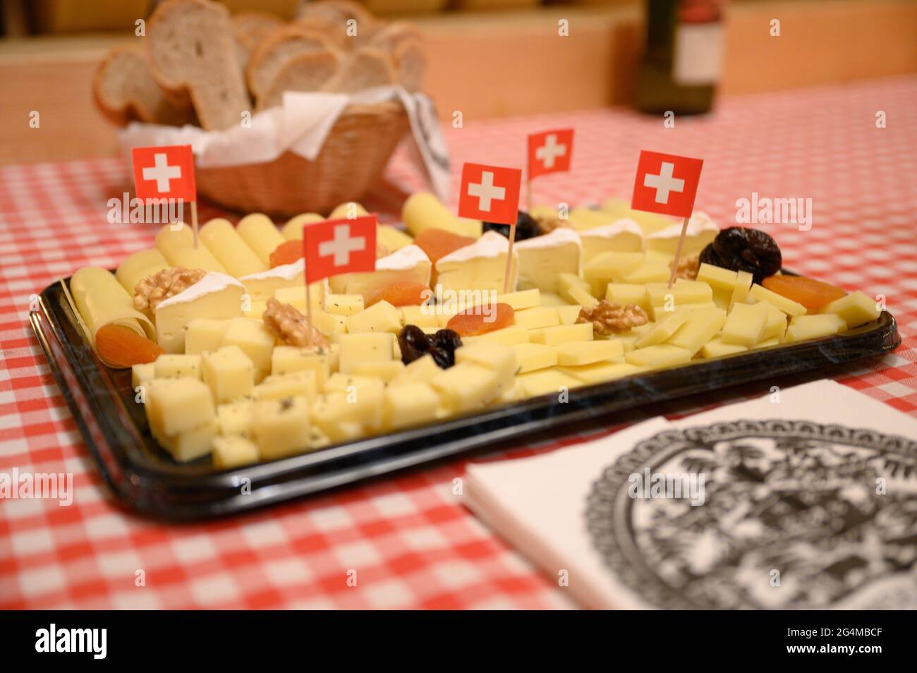 swiss cheese plate with swiss flags as a starter Stock Photo - Alamy