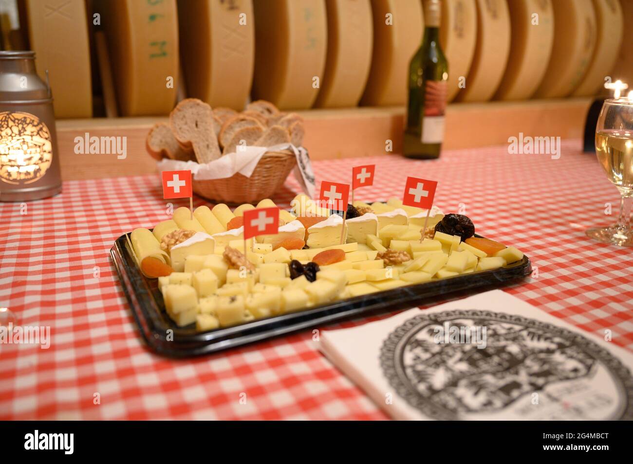 swiss cheese plate with swiss flags as a starter Stock Photo - Alamy