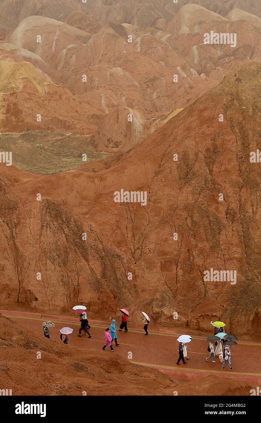 Wangye, China. 22nd June, 2021. Tourists walk into the Rainbow ...