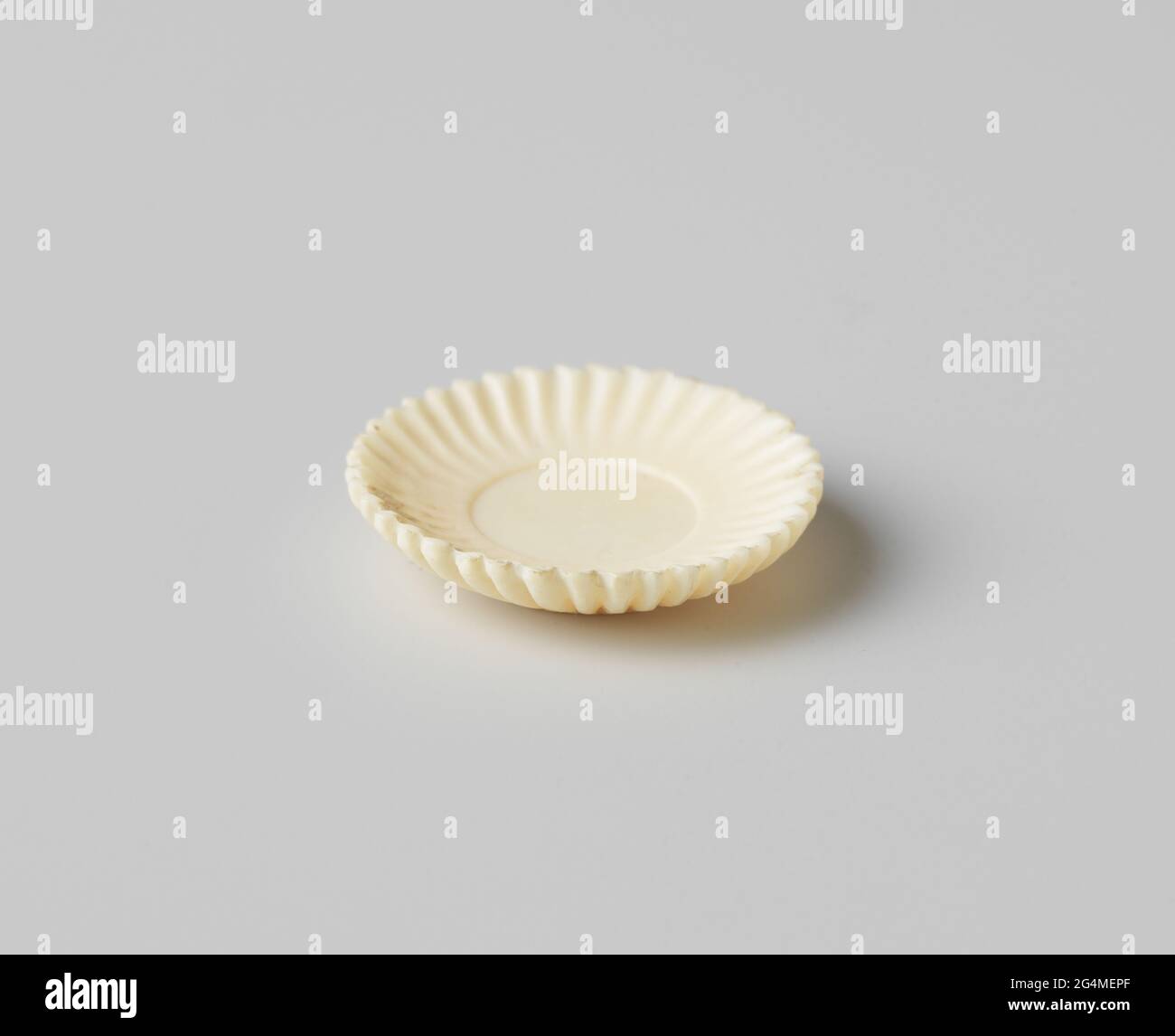 Dish with scalloped edge. Dish of ivory, with scalloped edge Stock ...