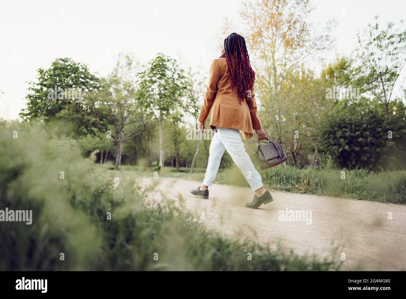 Young african american woman having a walk in a park Stock Photo - Alamy
