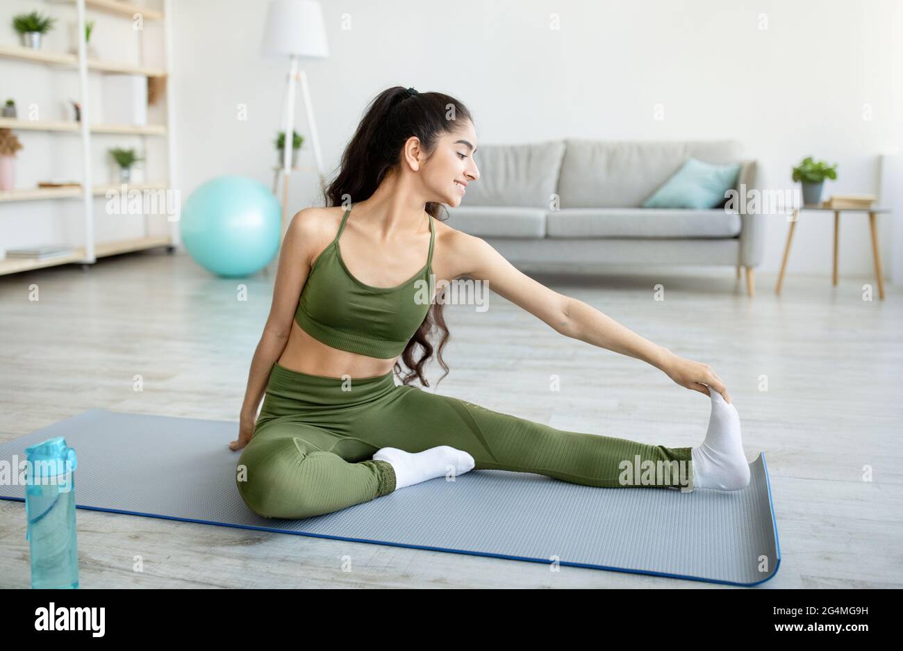 Indian lady yoga stretching hi-res stock photography and images - Alamy