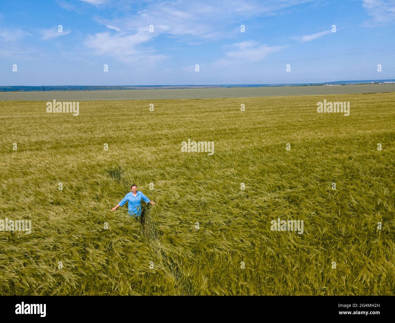 Beautiful woman walk in wheat hi-res stock photography and images - Alamy