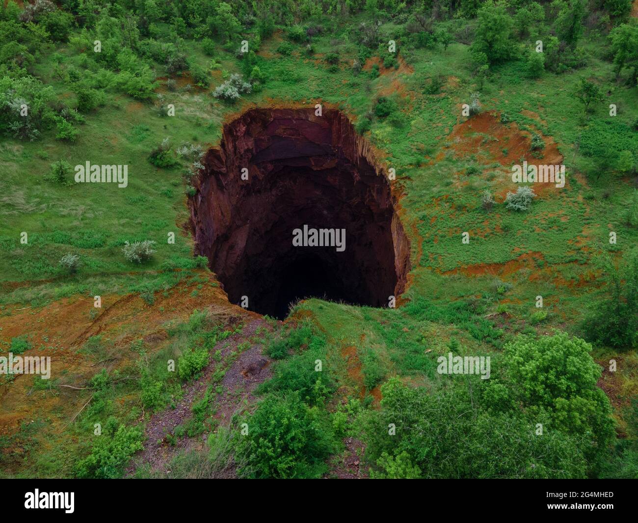 overhead view of collapsed mine big hole in land Stock Photo - Alamy