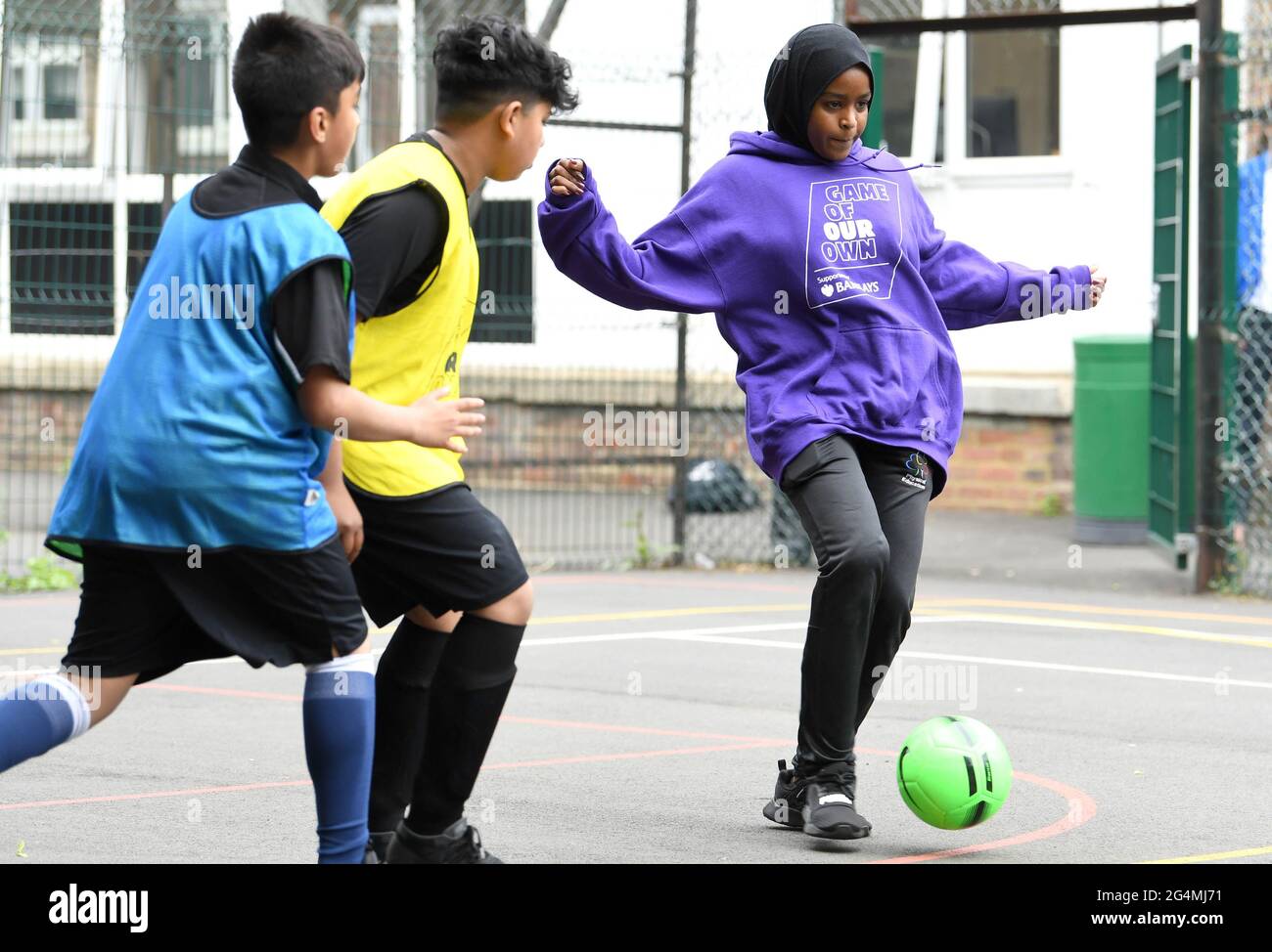 EDITORIAL USE ONLY School pupils in East London participate in a ...