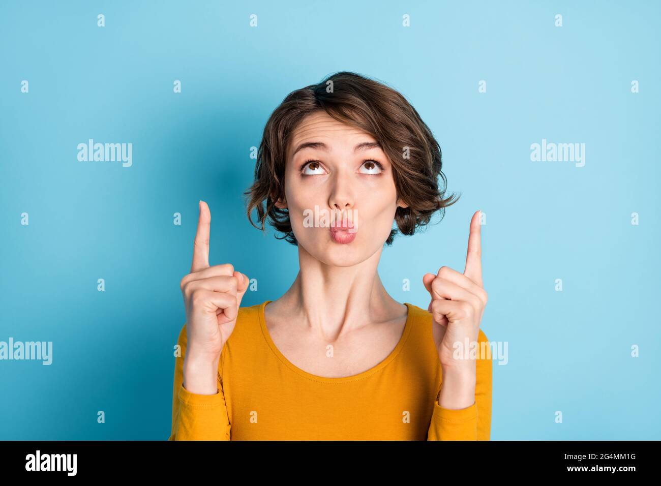 Photo Of Nice Impressed Brunette Lady Point Up Wear Yellow Shirt