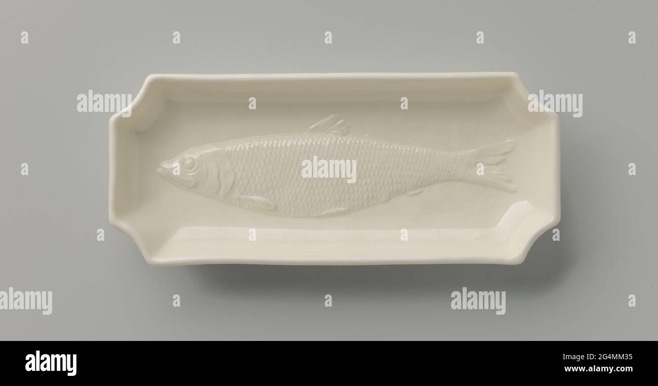 Herring scale, with a herring in relief on the bottom. Cream colored ...