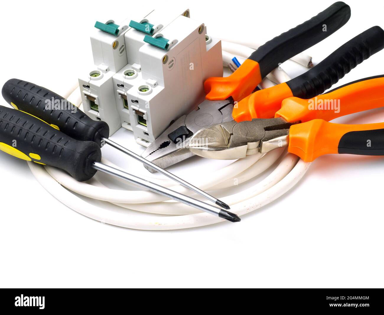 set of electrician tools and equipment and a coil of wire on a white ...