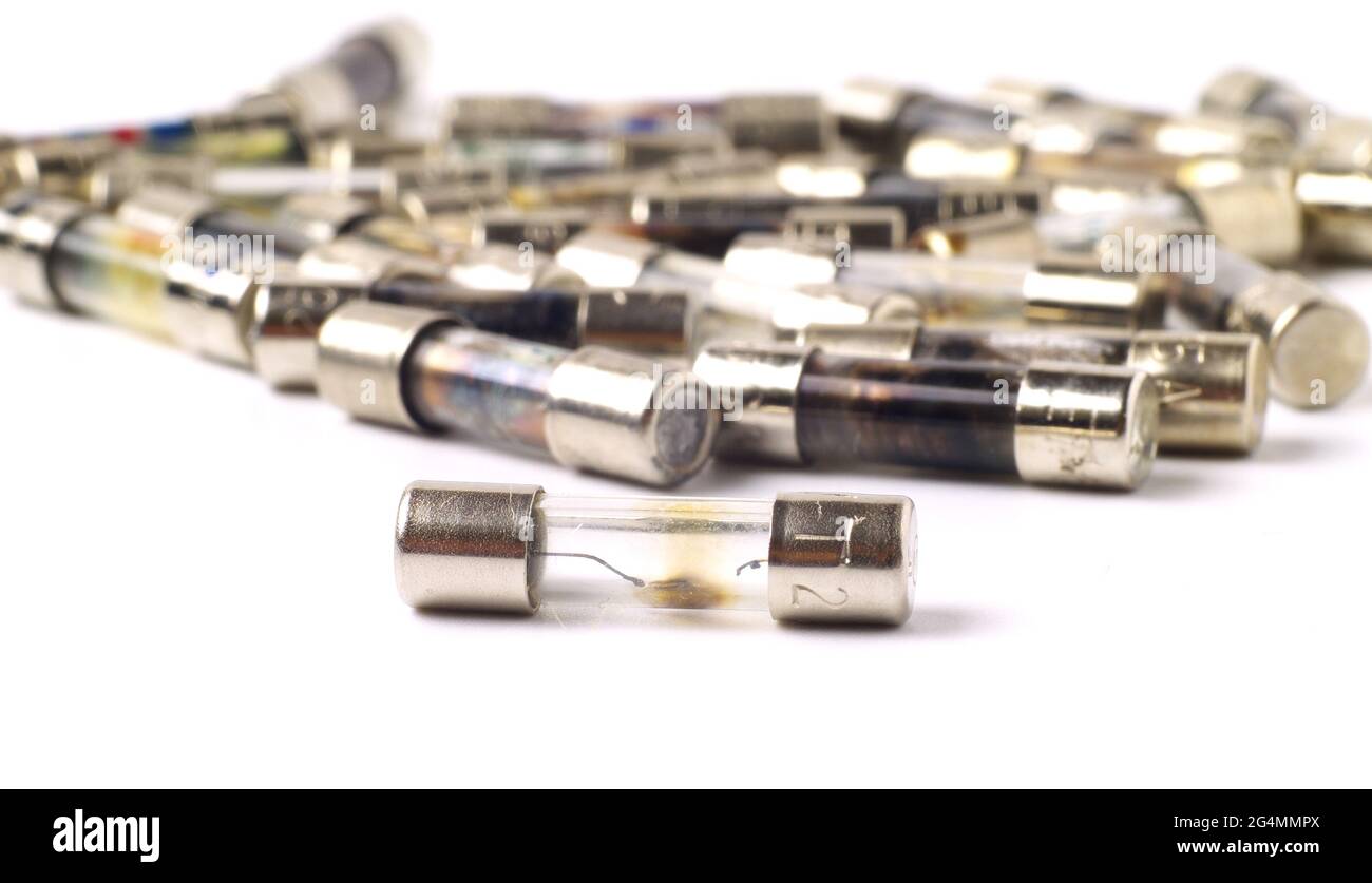 a bunch of blown fuses on white background, macro, shallow depth of ...