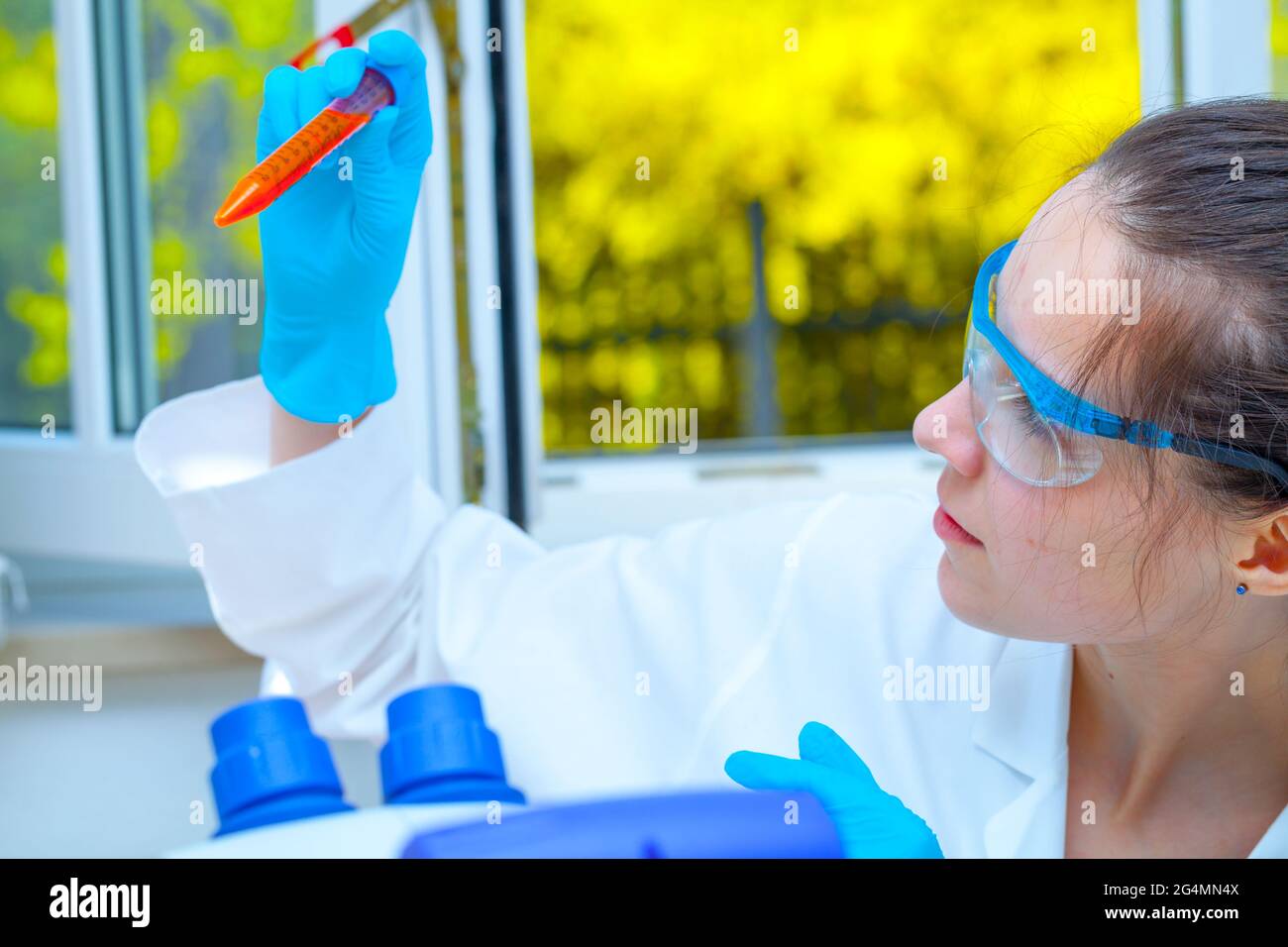 Girl laboratory Assistant works with an antiviral drug in a ...