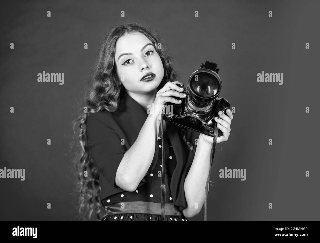 beautiful child photographer hold retro camera. journalist is my future ...