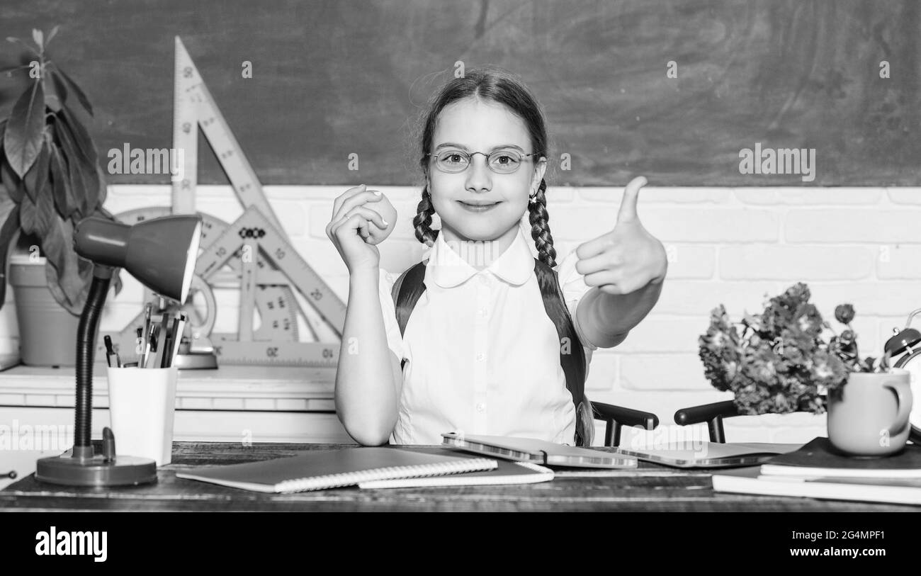 Girl small child eating apple snack. School break. Relax between ...