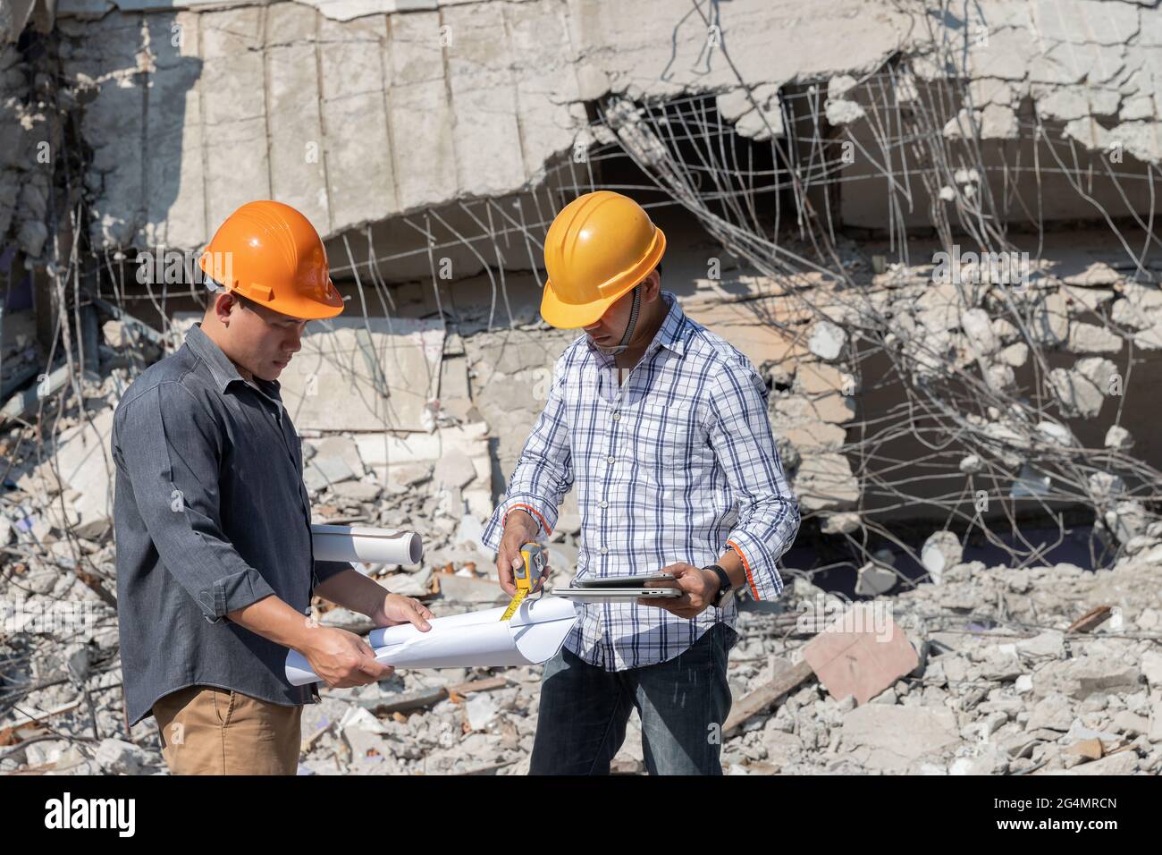 Demolition control supervisor and contractor discussing on demolish ...