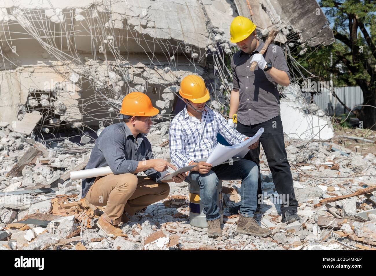 Demolition control supervisor and contractor discussing on demolish ...