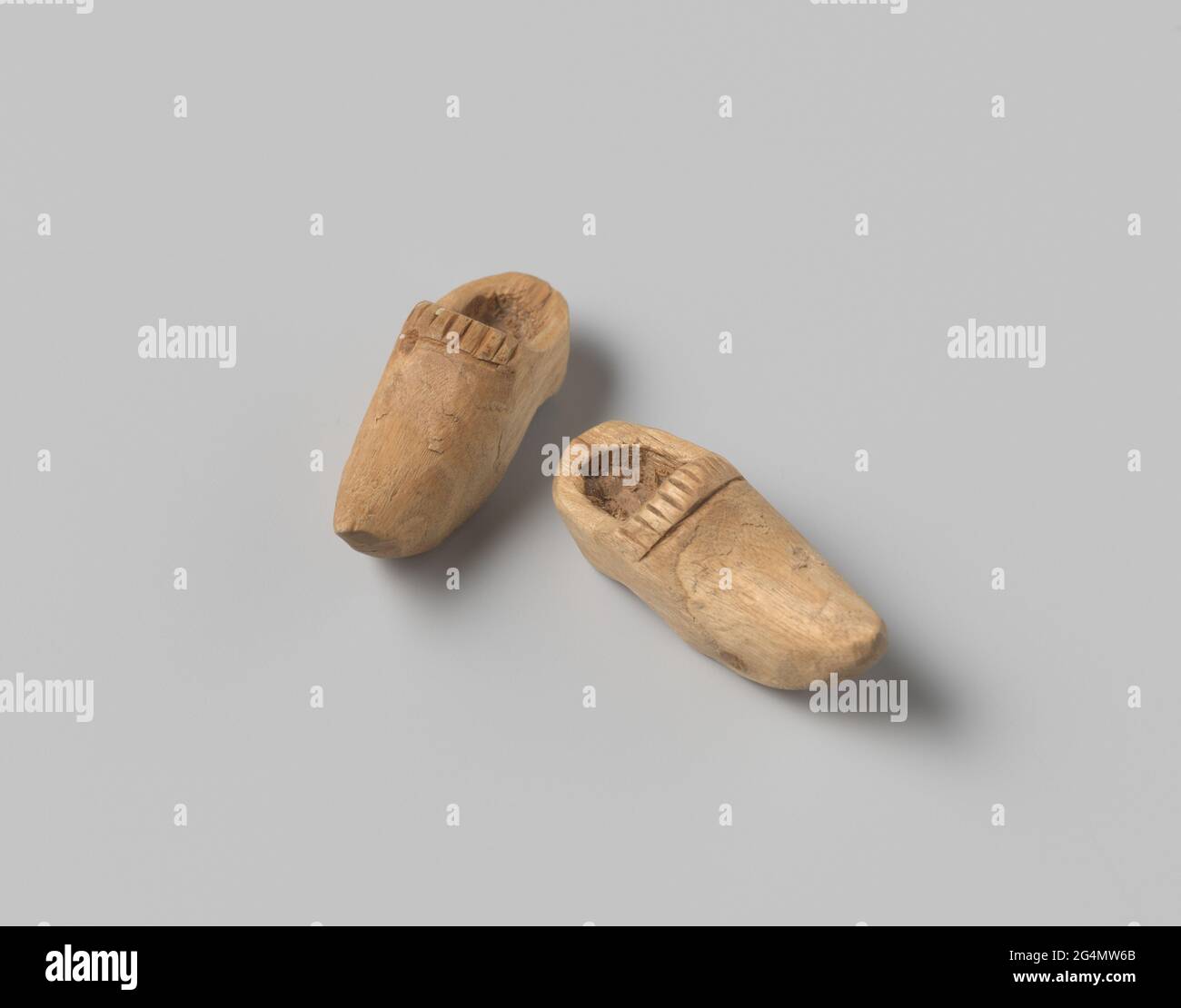 Five wooden clogs in a box, children's toys. Five wooden clogs in a box ...