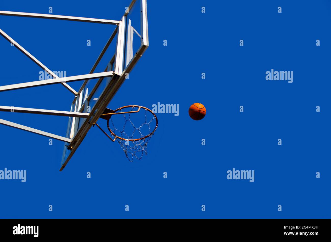 Basketball backboard with a ring on the street on the playground ...