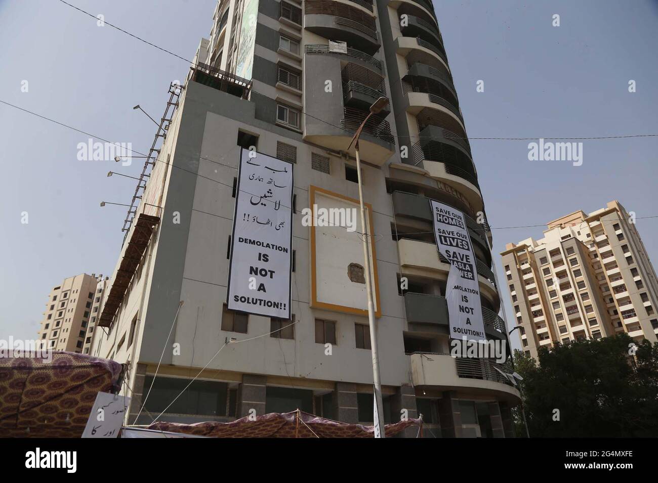 View of banners seen hanging on Nasla Tower against the demolition ...