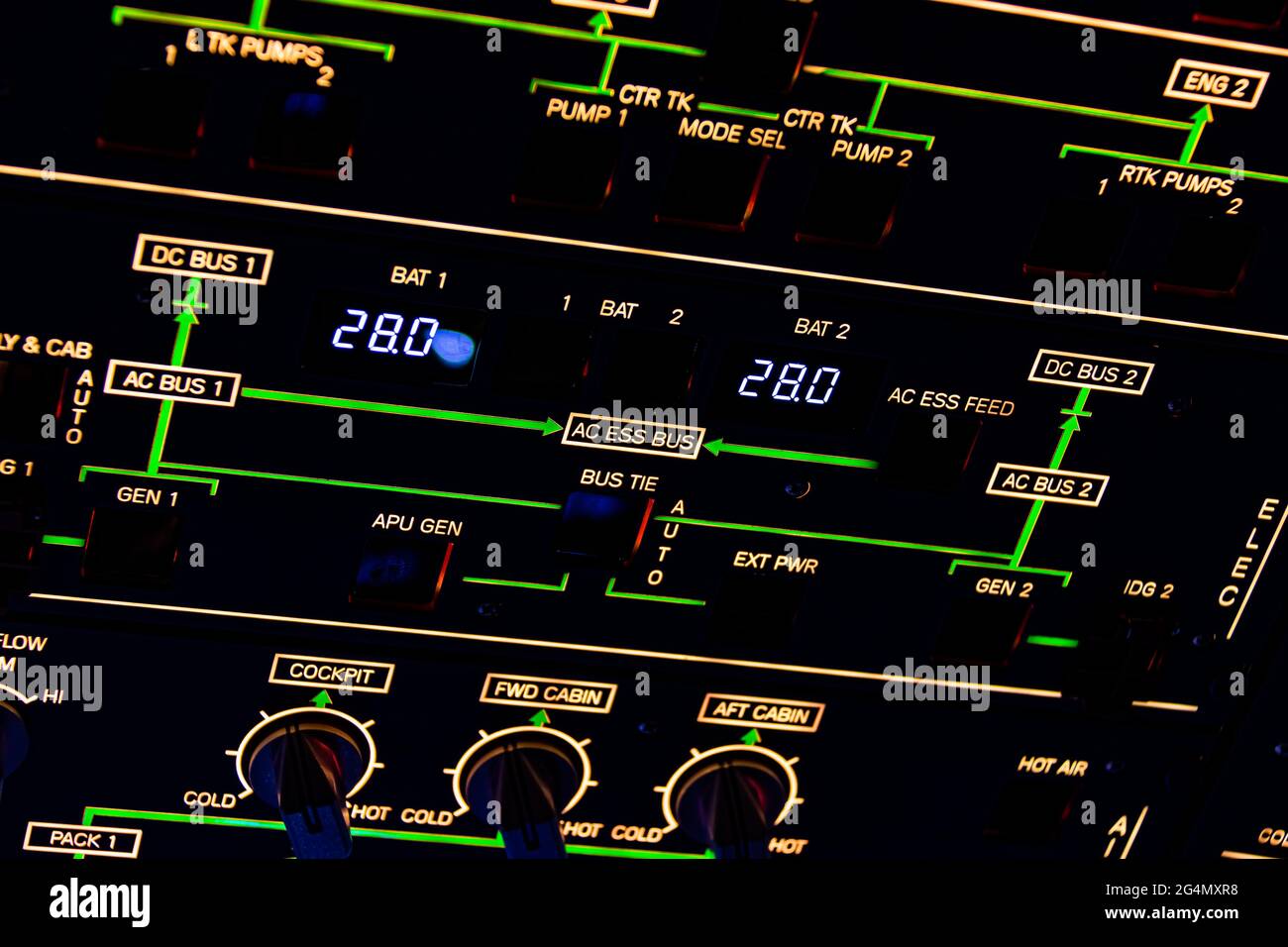 A close up of the overhead panel of a commercial airplane, with ...