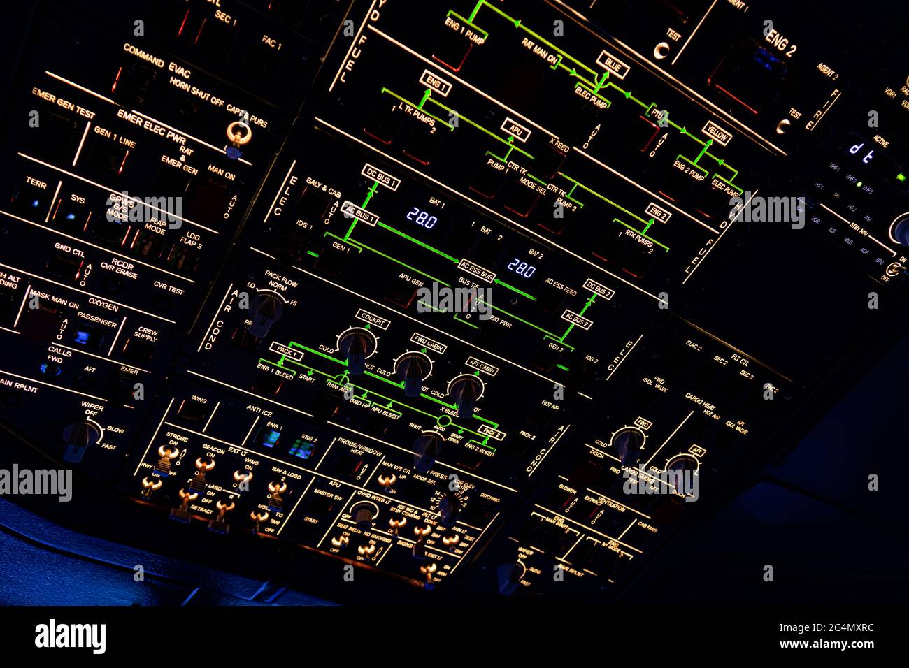 A close up of the overhead panel of a commercial airplane, with ...