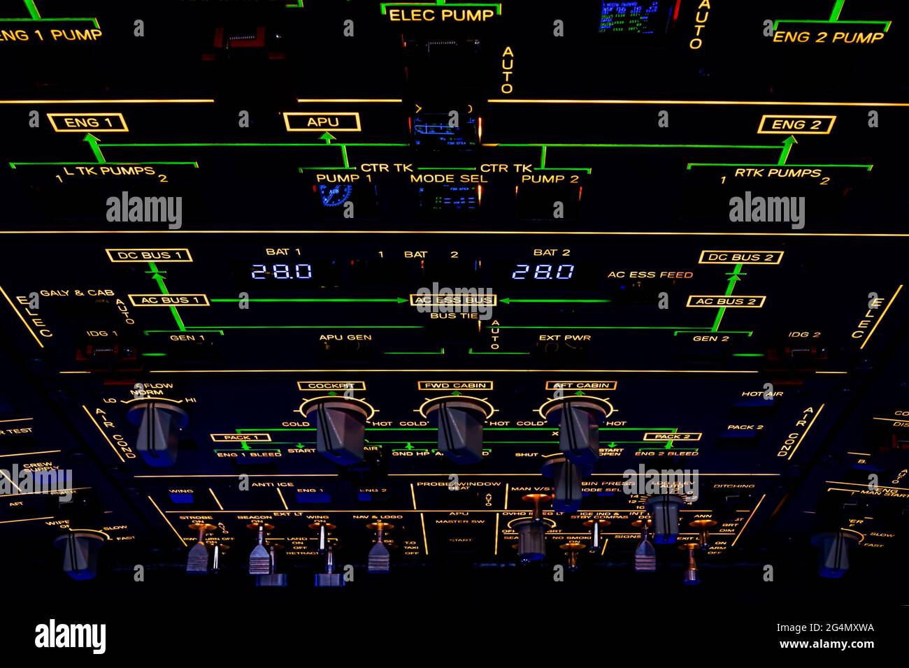 A close up of the overhead panel of a commercial airplane, with ...