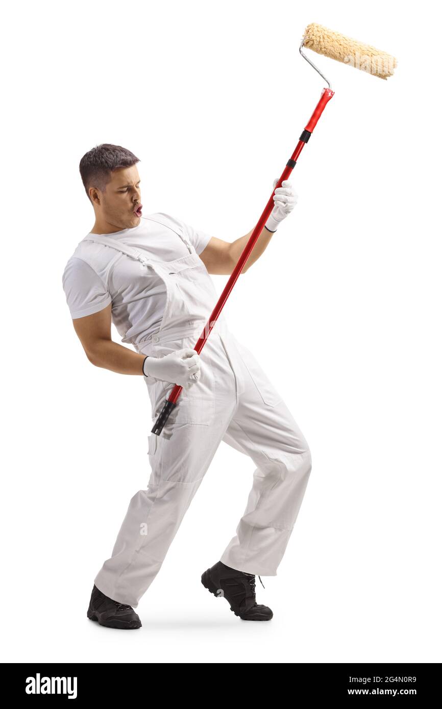 Full length portrait of a painter dancing and playing on a paint roller ...