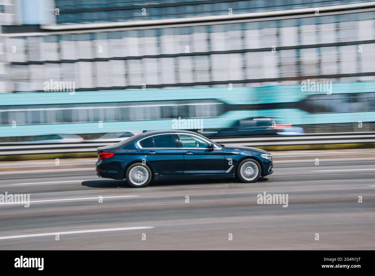 Ukraine, Kyiv - 29 April 2021: Blue BMW 5 Series car moving on the ...