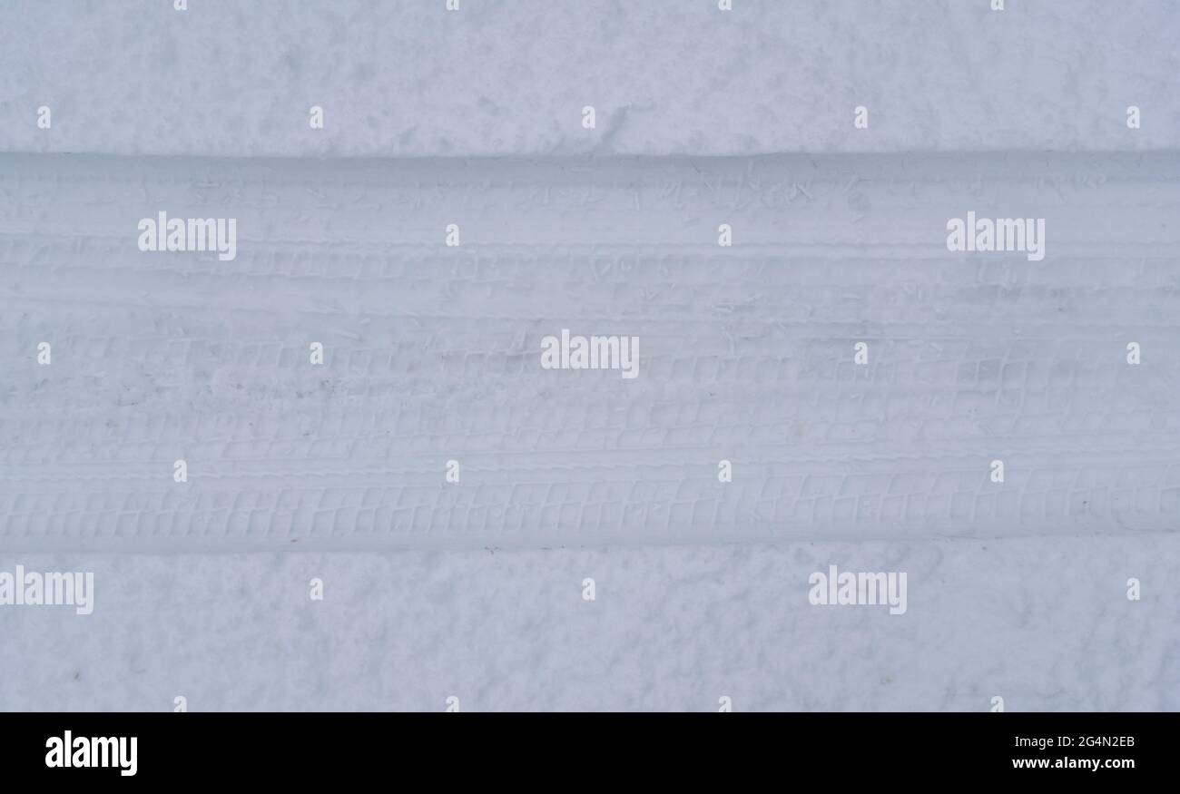 car wheel trace texture on the winter surface outdoor on the race track ...