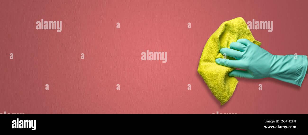woman hand on latex glove holding a color rag isolated and wash a color ...