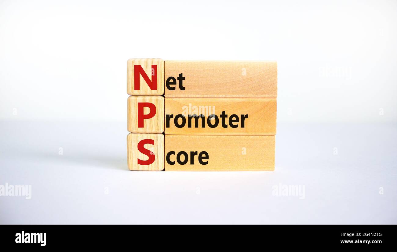 NPS net promoter score symbol. Wooden blocks with words 'NPS net ...