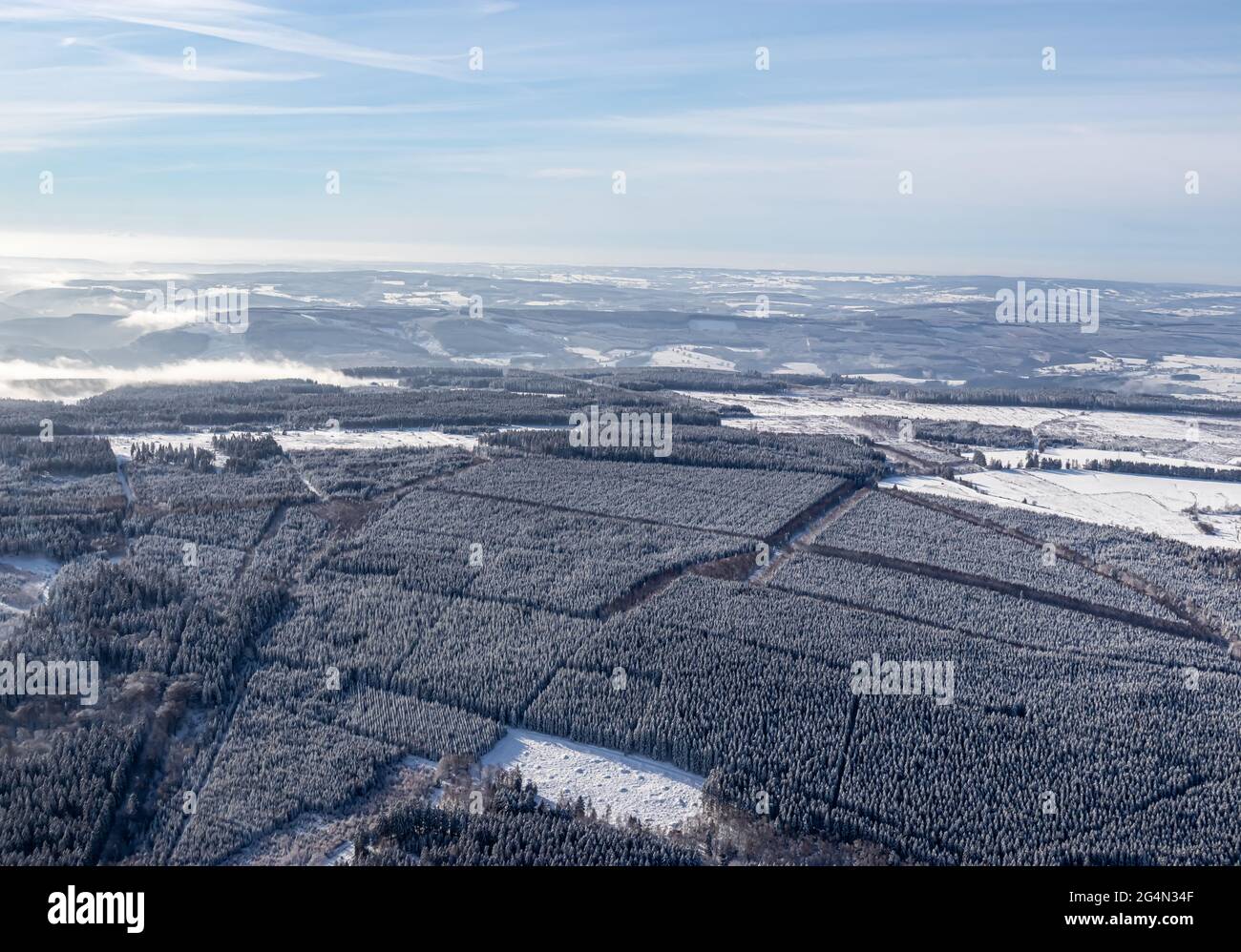Aerial overview of the Belgian Ardennes during a winter flight with an ...