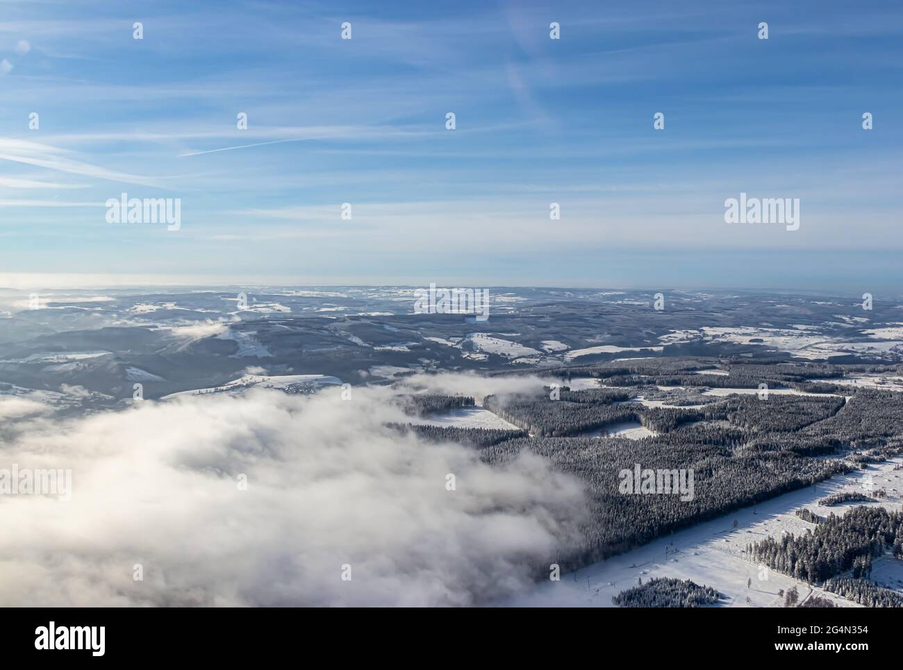 Aerial overview of the Belgian Ardennes during a winter flight with an ...