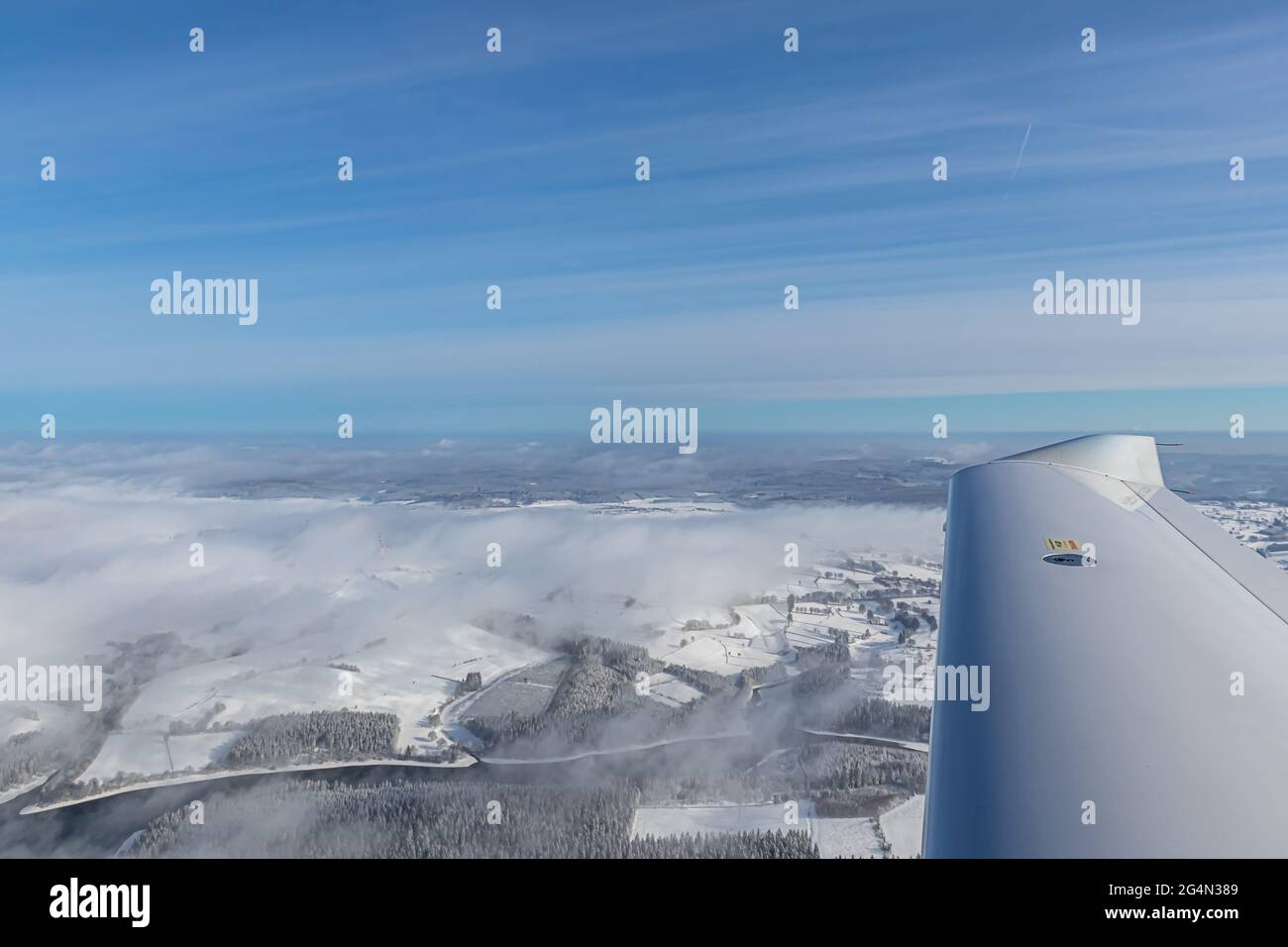 Aerial overview of the Belgian Ardennes during a winter flight with an ...