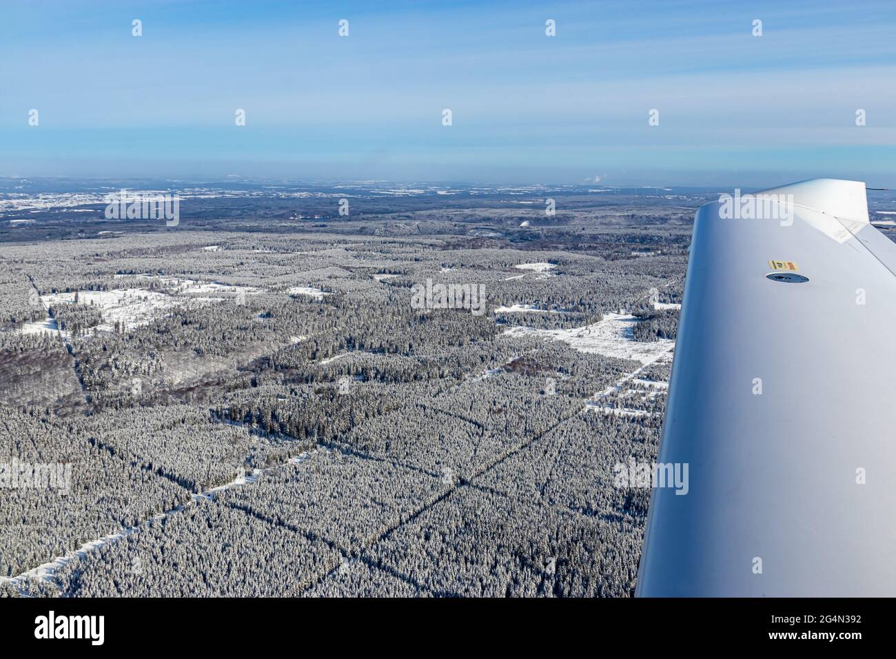 Aerial overview of the Belgian Ardennes during a winter flight with an ...