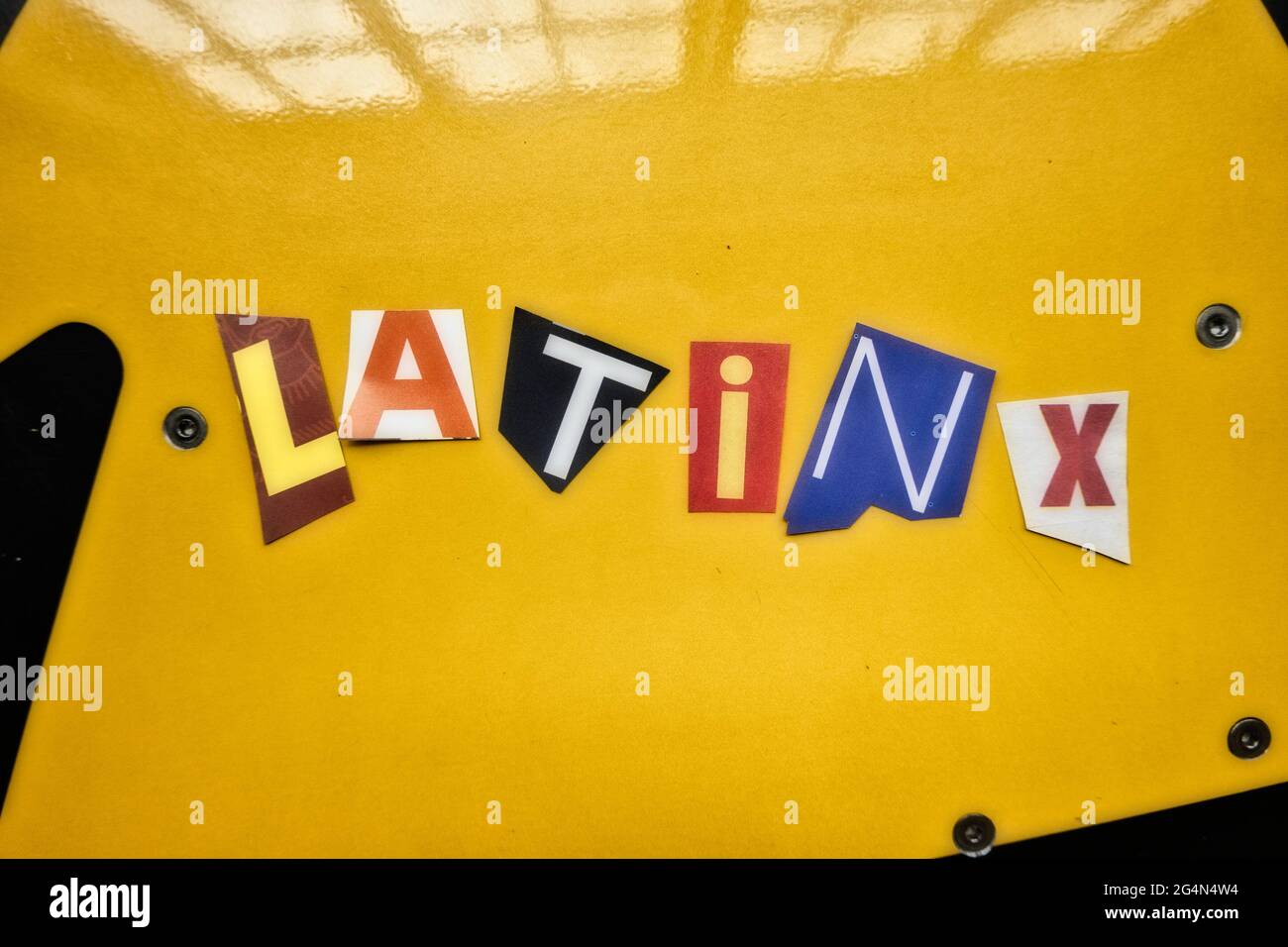 The word "Latinx" using cut-out paper letters in the ransom note effect ...