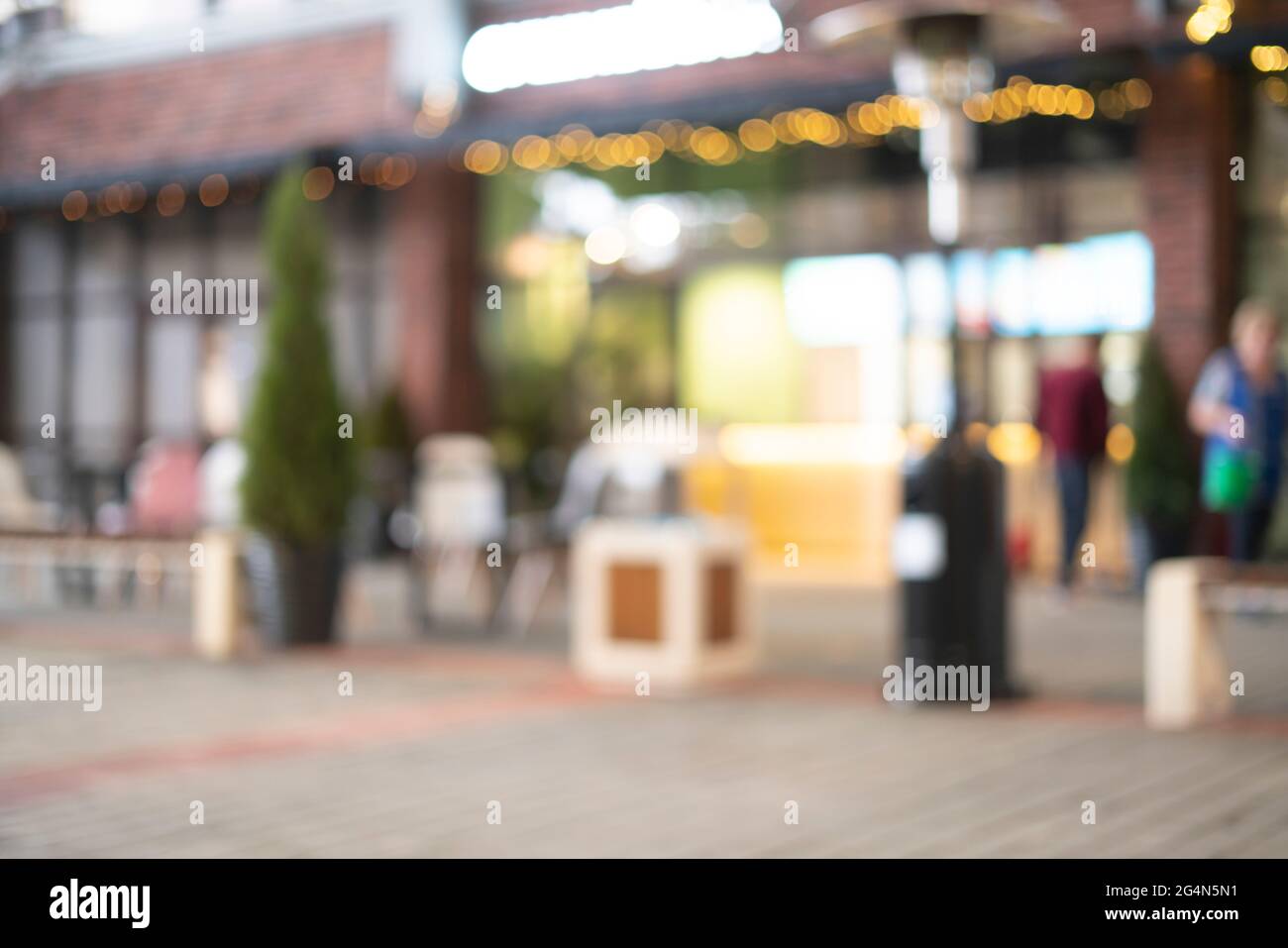 out of focus blurred background of public place with food court and ...