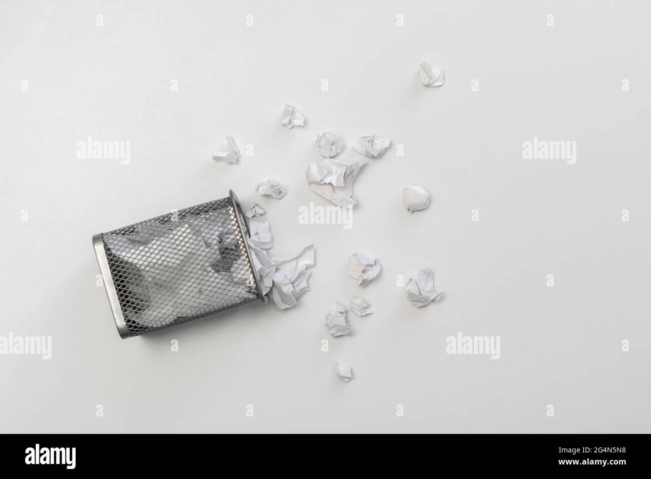 the bunch of crumpled paper balls in the metal rubish bin urn basket on ...