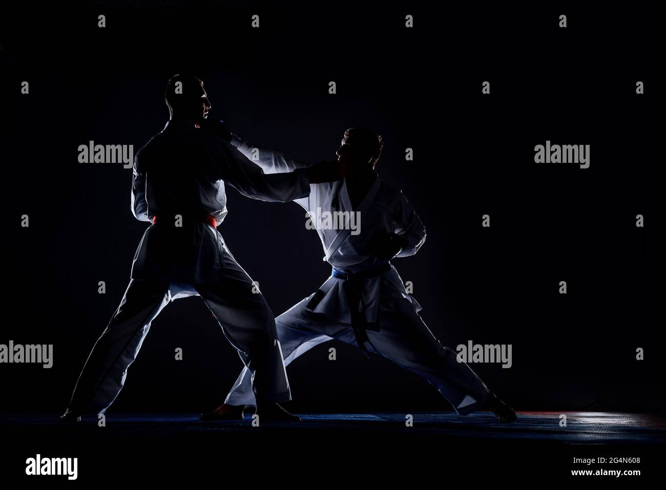 Fighting concept. Fighting man in kimono. Karate men in fighting stance ...