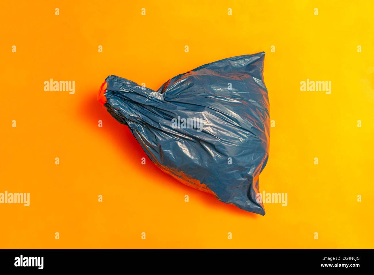 the plastic trash bag package full of rubish on the colorful background ...