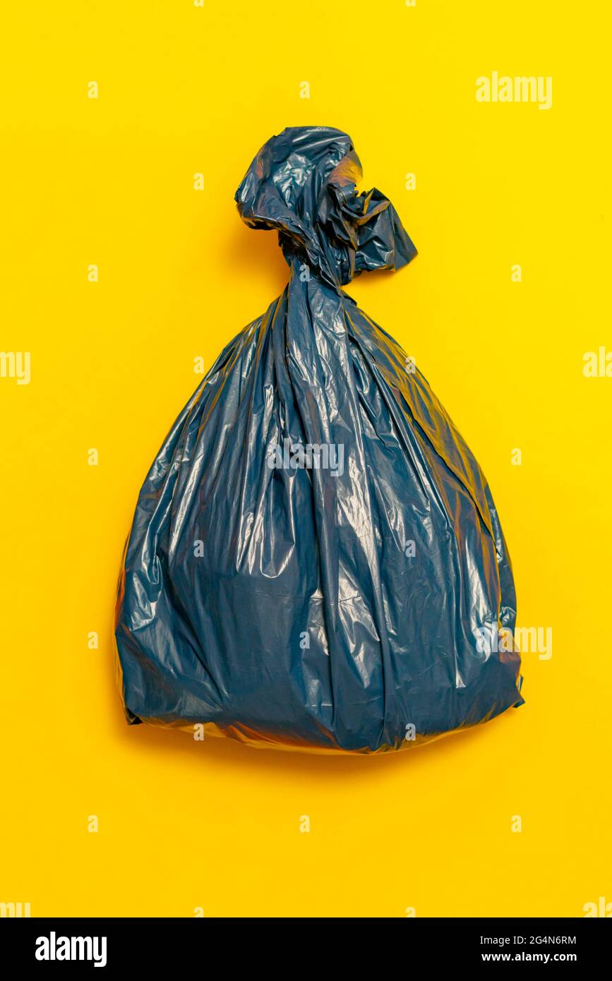 the plastic trash bag package full of rubish on the colorful background ...