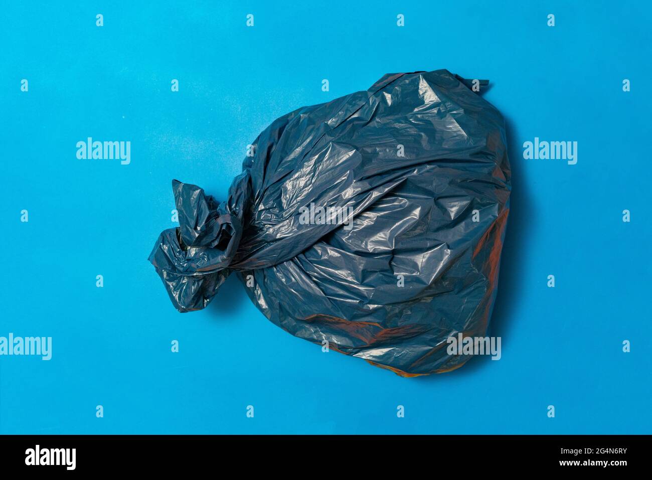 the plastic trash bag package full of rubish on the colorful background ...