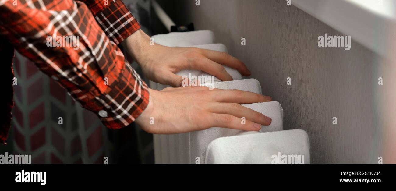 Frozen hands touch heating hi-res stock photography and images - Alamy