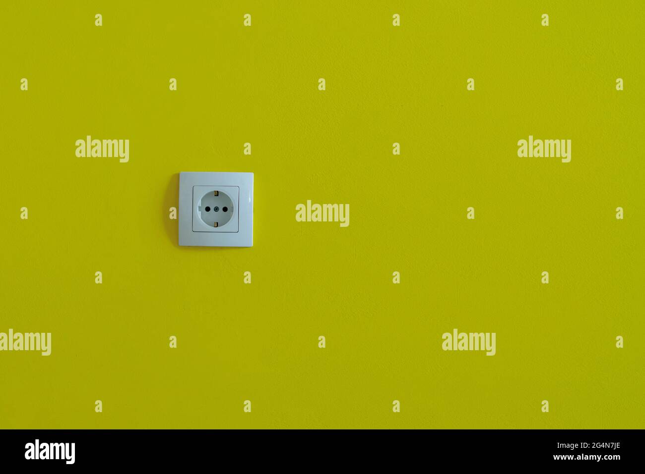 simple single white electricity socket in the wall at home apartment ...