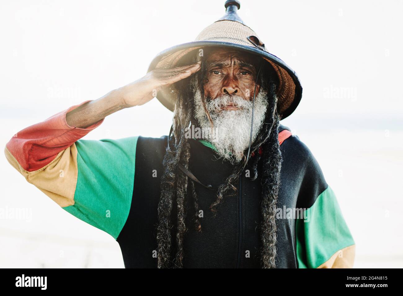 Portrait of old rastafari with dreadlocks looking at the camera in the ...