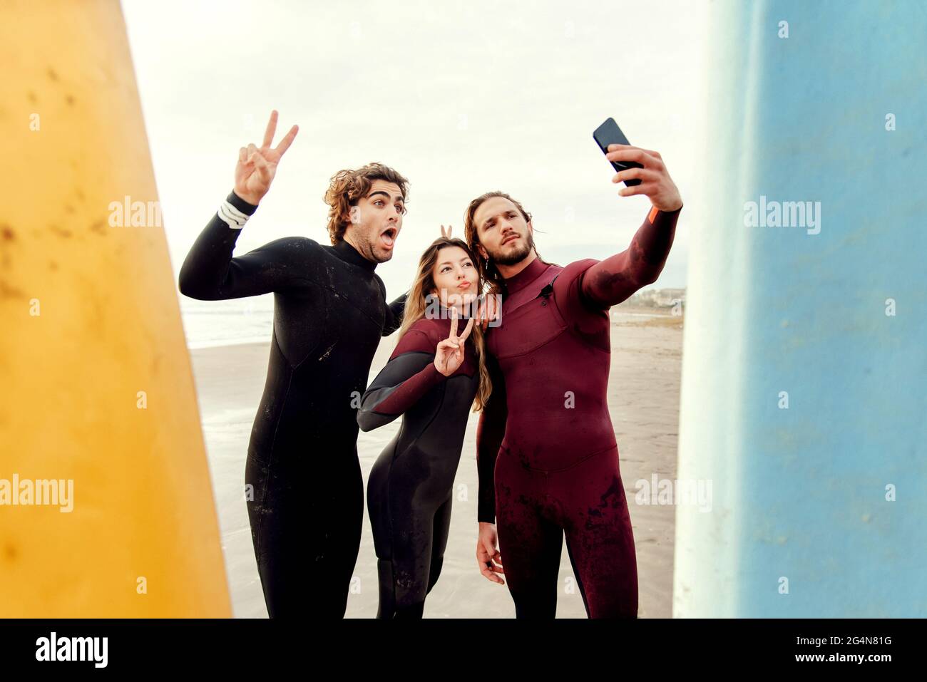 Group is standing in the surf on the beach hi-res stock photography and ...