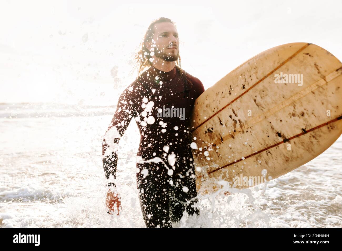 Run into ocean beach wetsuit High Resolution Stock Photography and ...