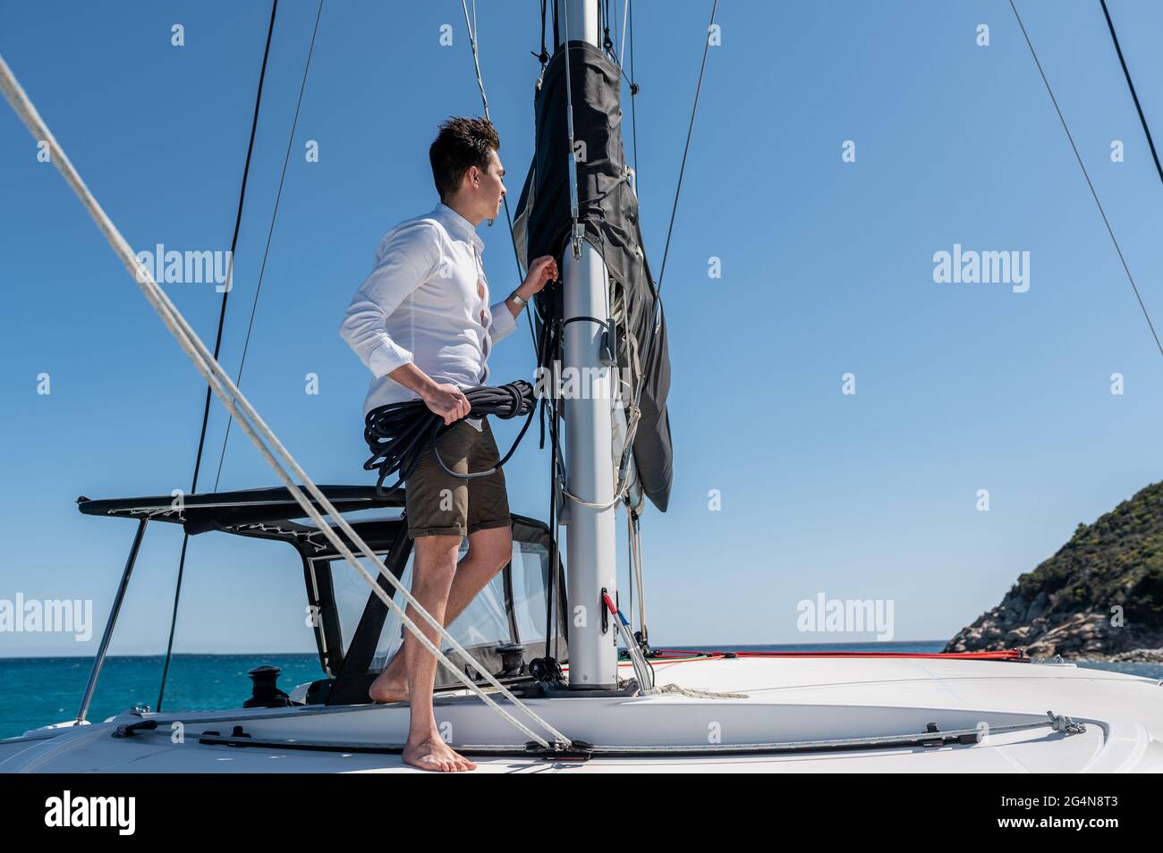 Standing on sailboat mast hi-res stock photography and images - Alamy