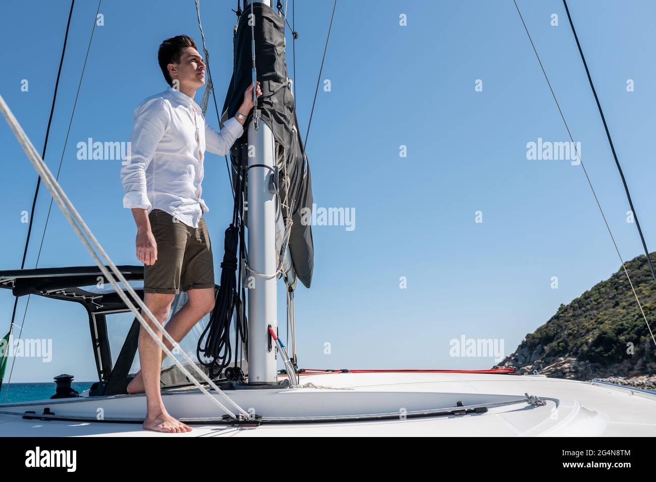 Standing on sailboat mast hi-res stock photography and images - Alamy