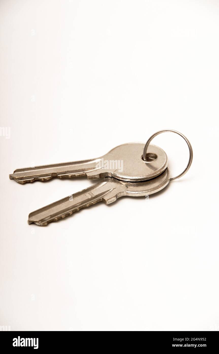 Chrome metal modern home door key on ring, isolated on white background ...