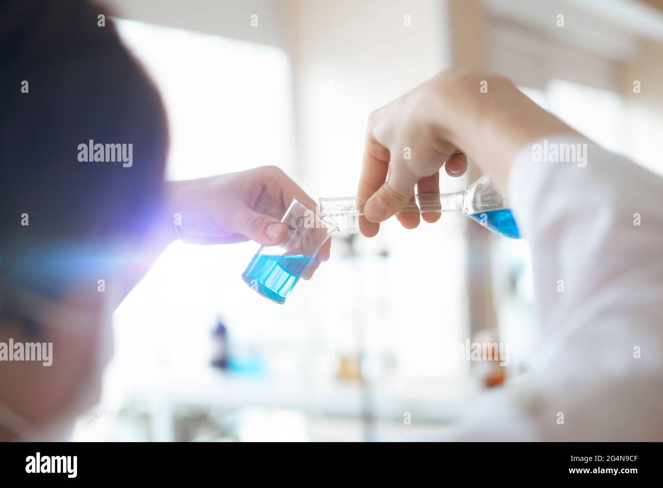 the medic person doctor in the hospital laboratory hold glass flask ...