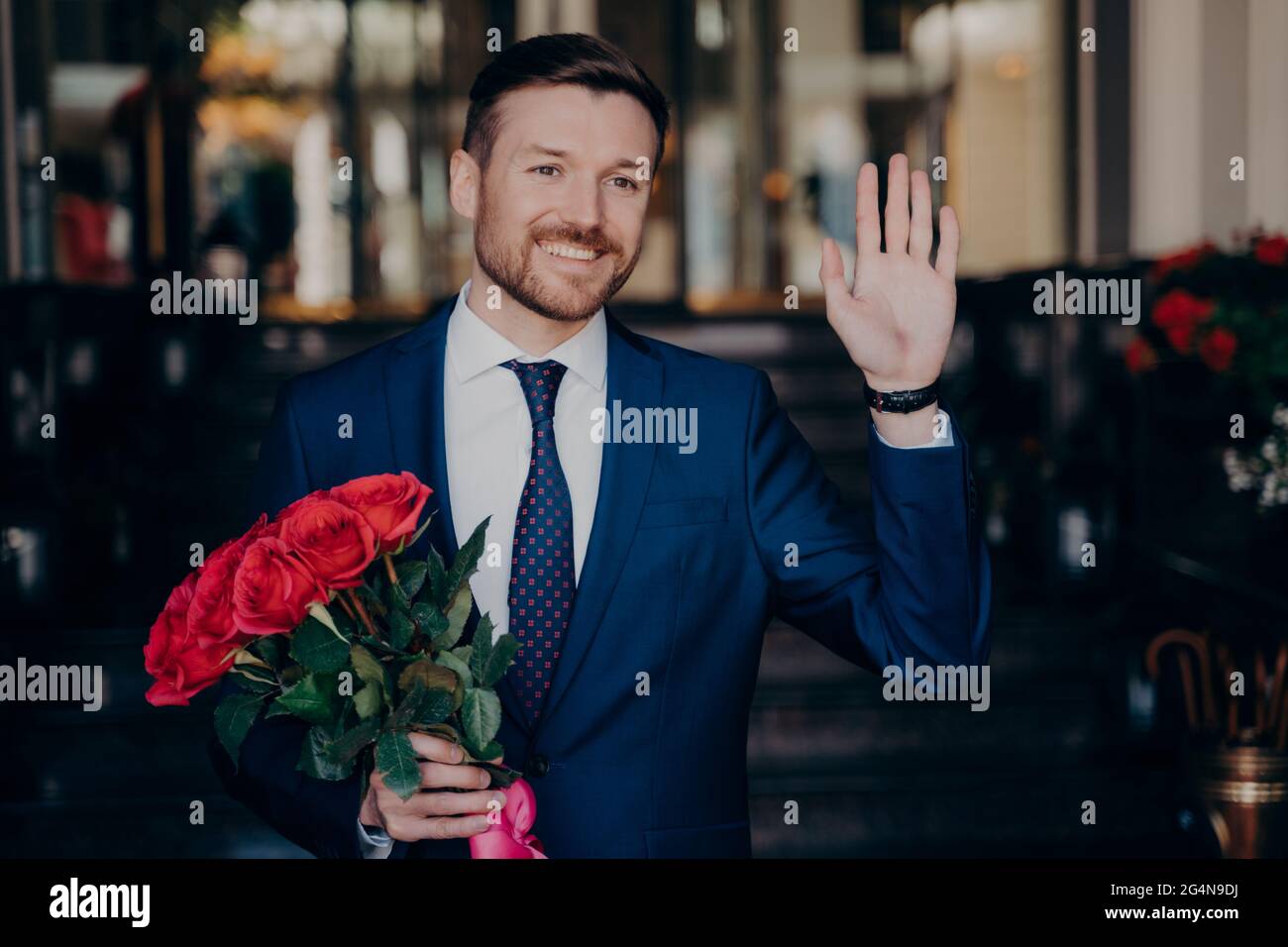 Man red rose in hand hi-res stock photography and images - Alamy